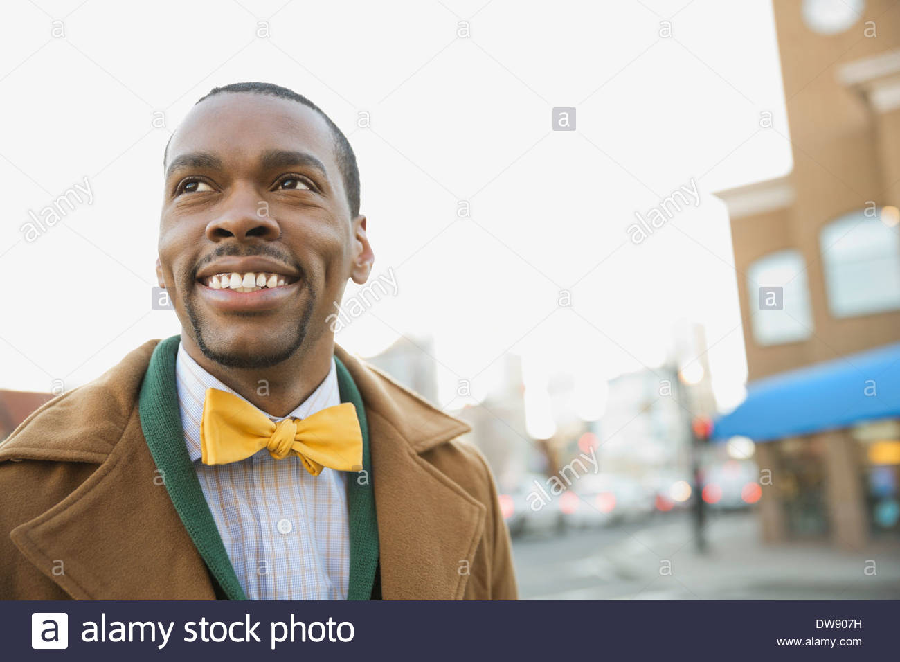 Smiling man outdoors wearing bow tie Stock Photo - Alamy