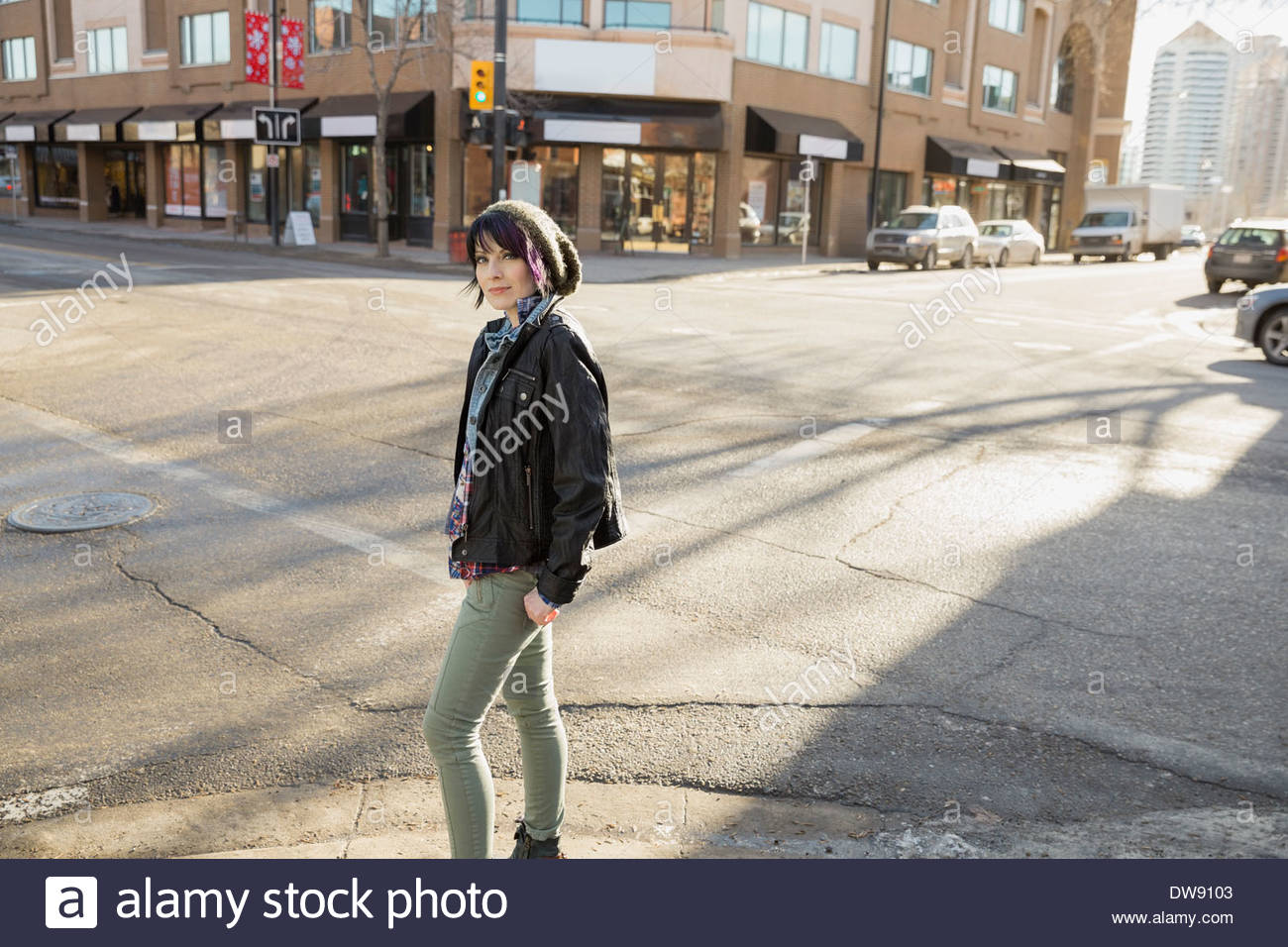 Woman standing on the street hi-res stock photography and images - Alamy