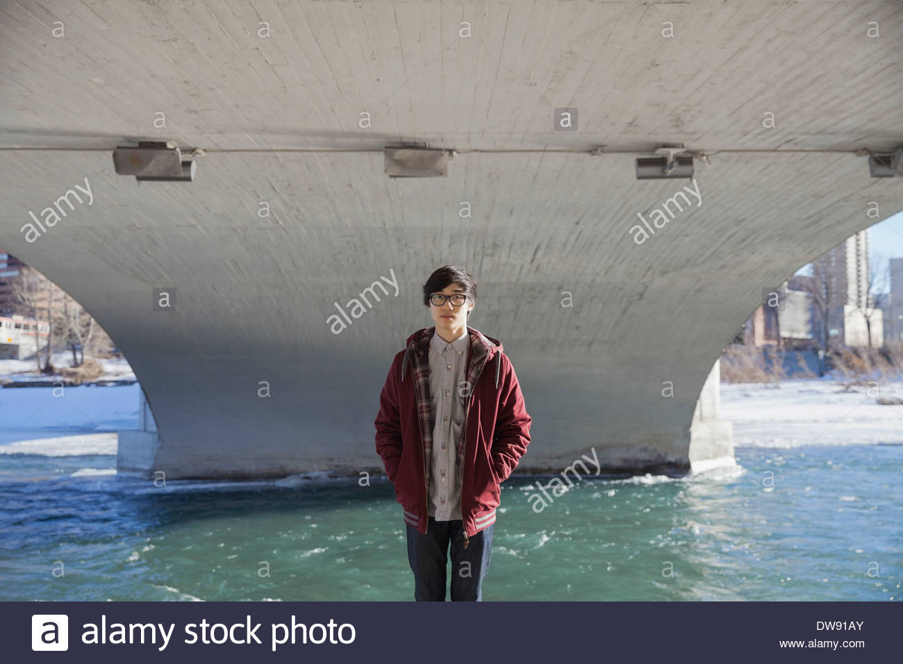 Young man standing bridge hi-res stock photography and images - Alamy