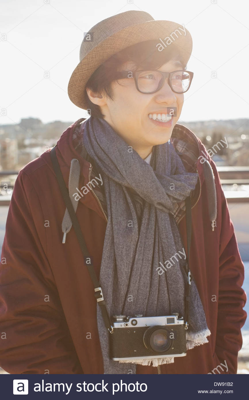Young man with old camera hi-res stock photography and images - Alamy
