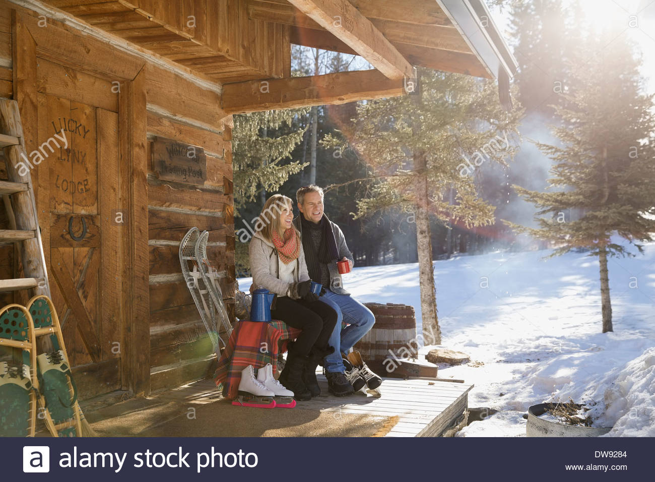 Couple sitting on cabin porch hi-res stock photography and images - Alamy
