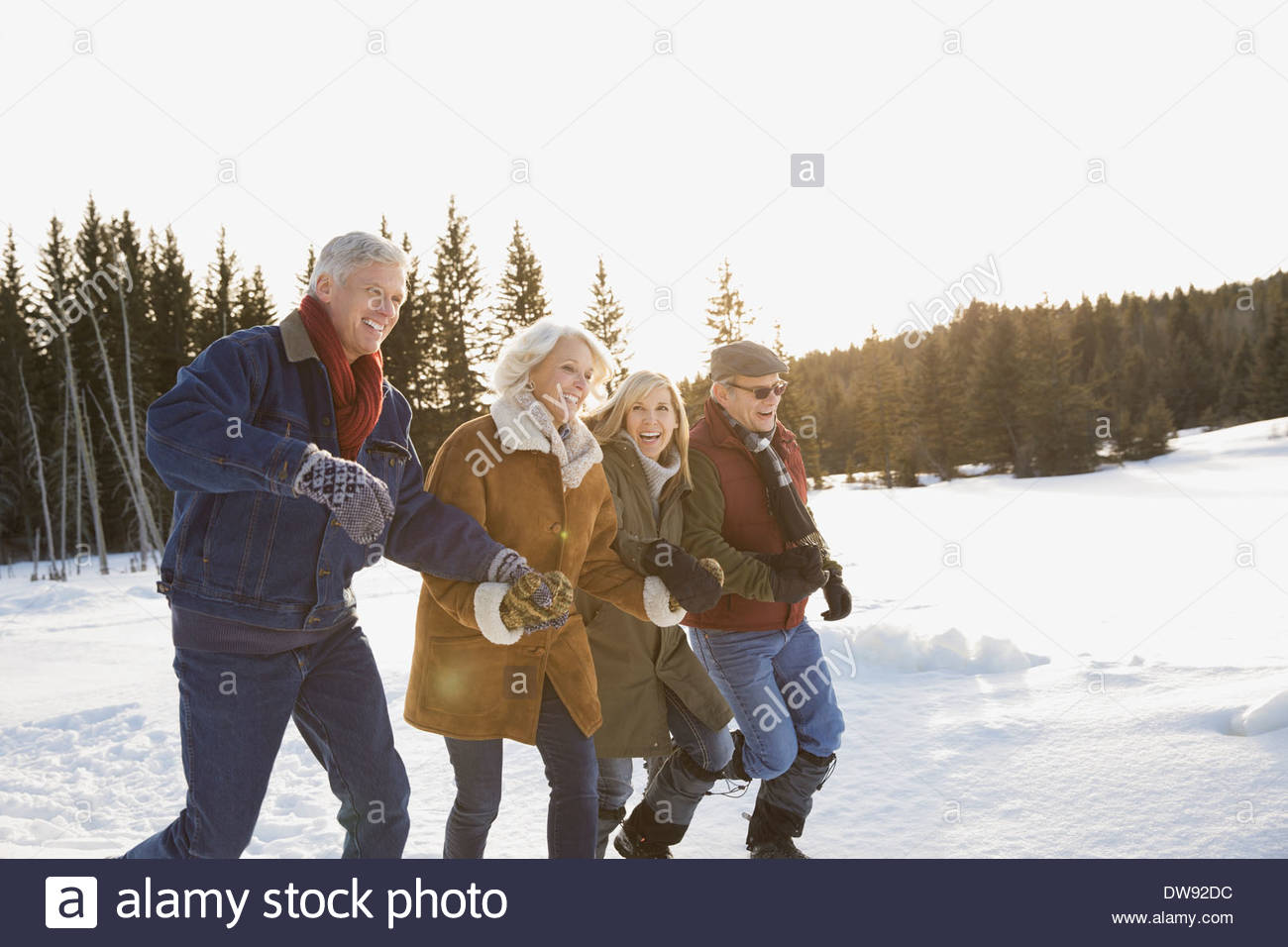 Adult running through snow hi-res stock photography and images - Alamy