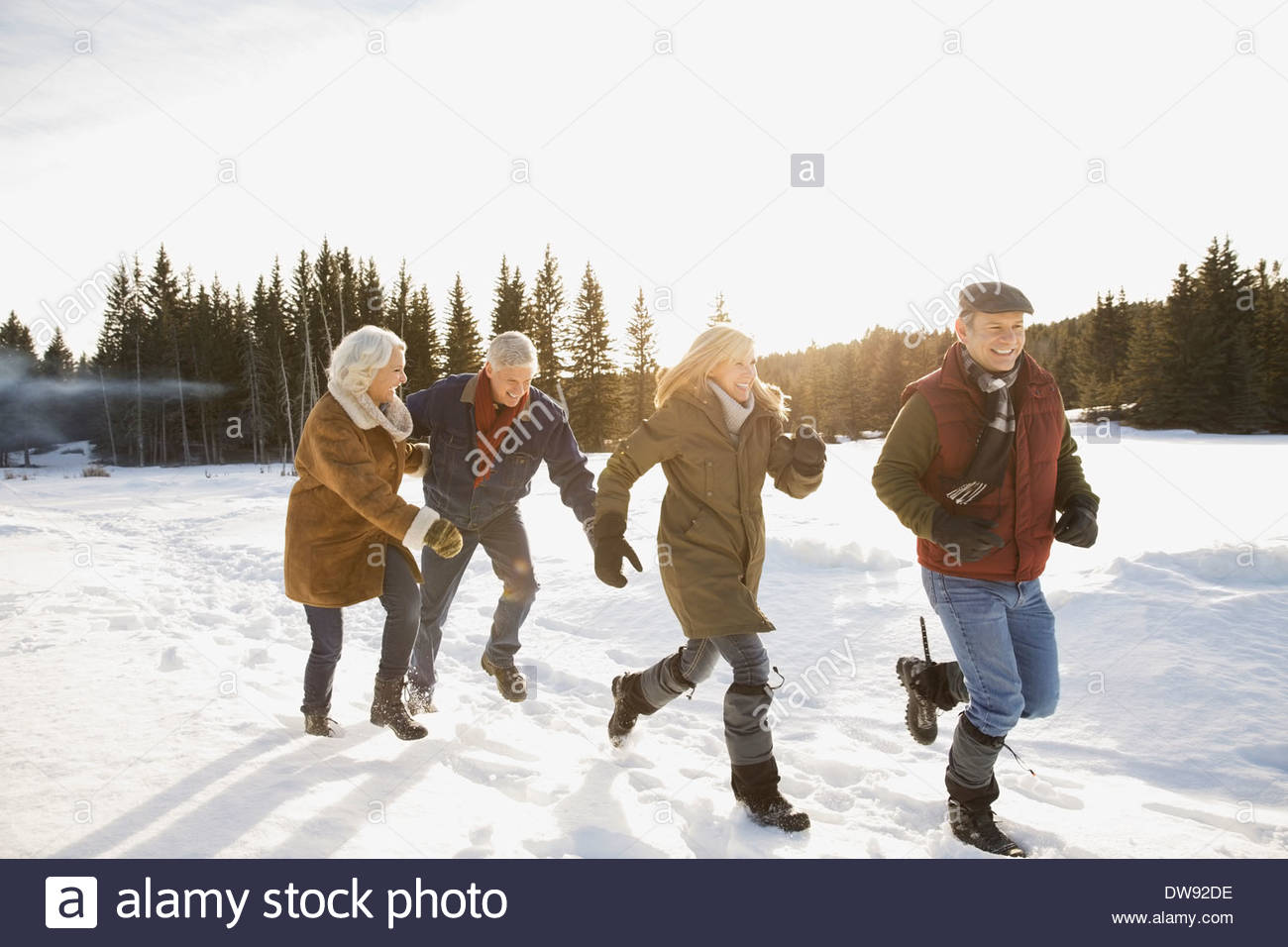 Adult Running Through Snow Stock Photos & Adult Running Through Snow ...