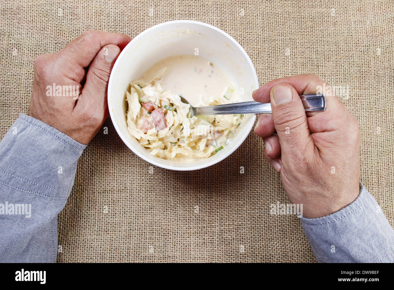 Top view of hungry man over his meal.Top view of hungry man over his ...