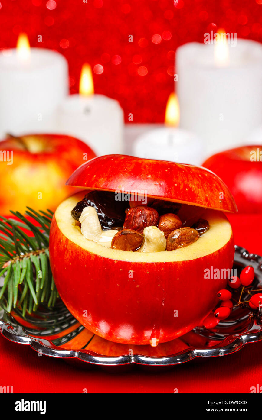 Red christmas apples stuffed with dried fruits in honeyRed christmas ...