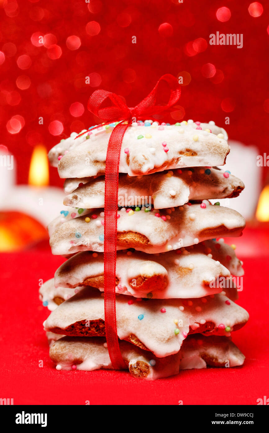 Stack of gingerbread cookies in star shape on red backgroundStack of ...