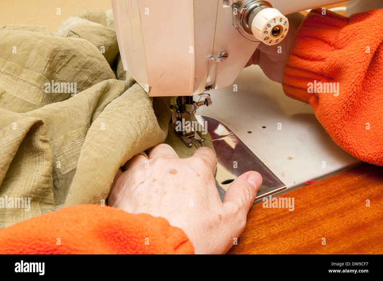 woman sewing clothes in a sewing machine Stock Photo - Alamy
