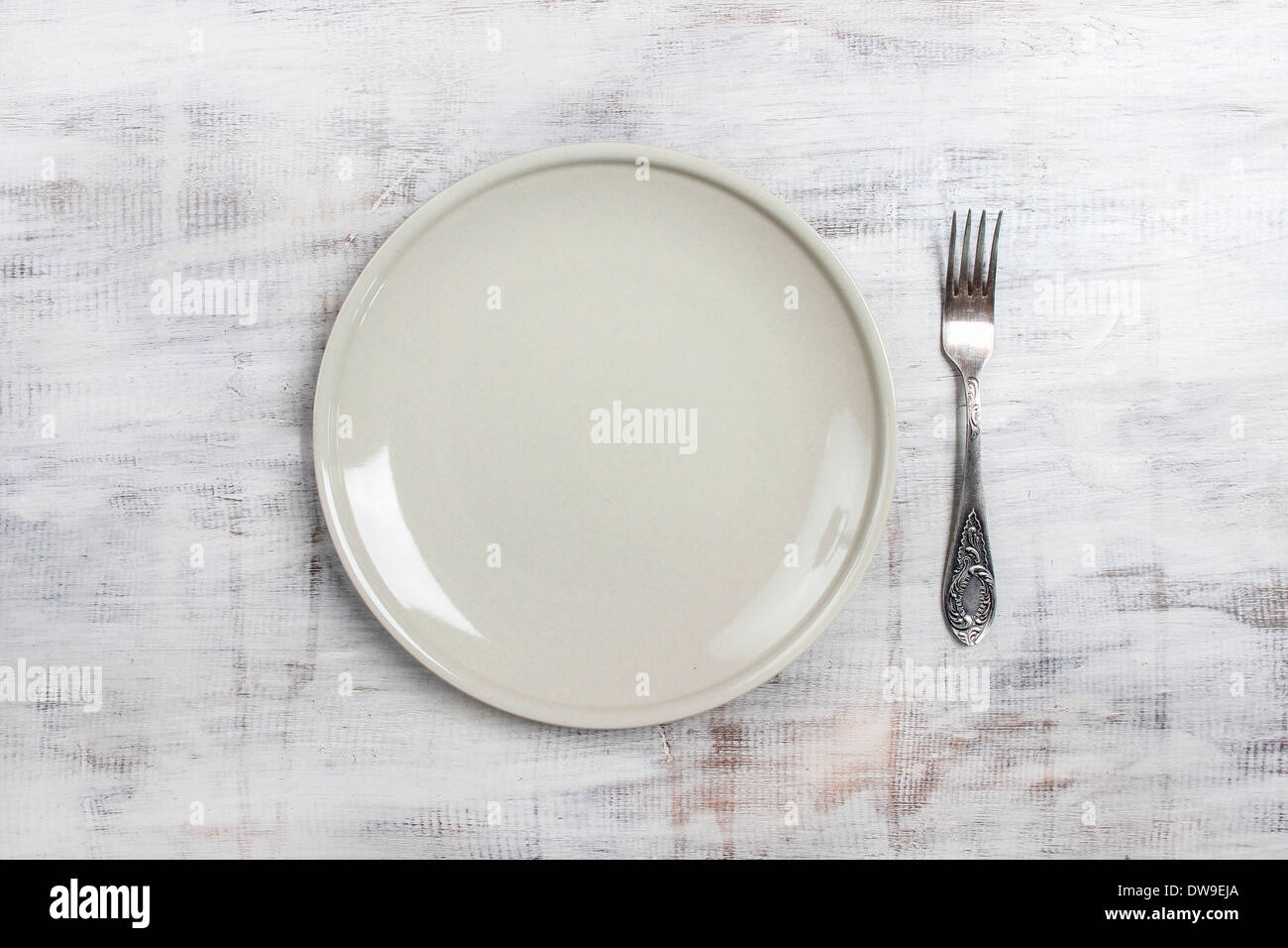 Top view empty plate on rustic wooden tableTop view empty plate on ...