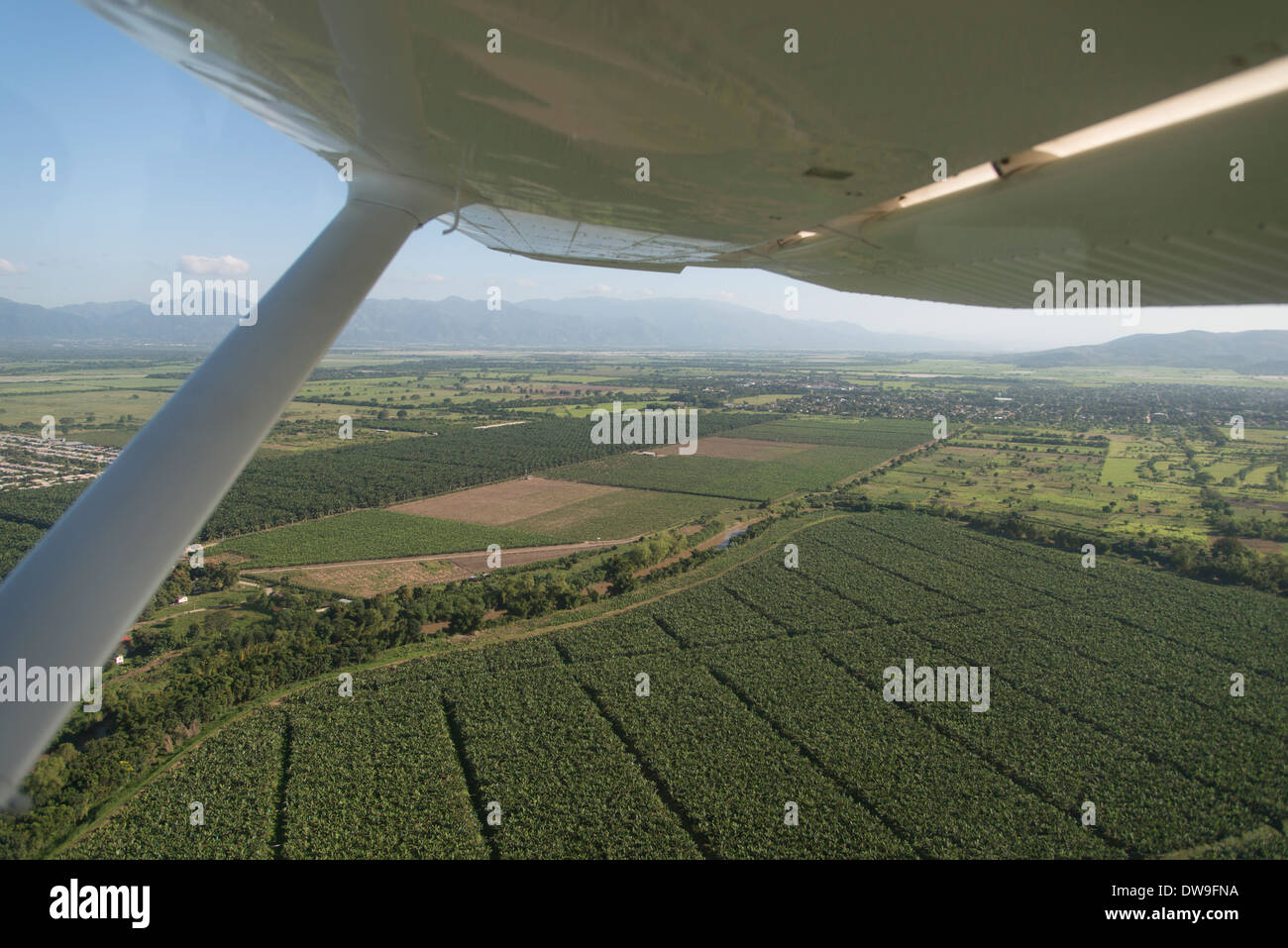 Seaplane flying over agricultural fields Bay Islands Honduras Stock ...