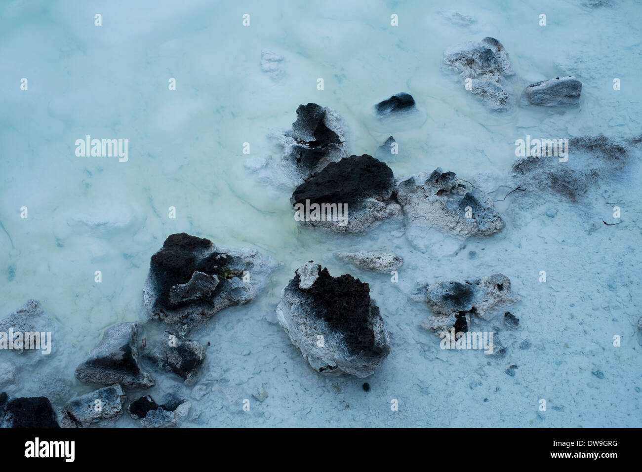 Steam hangs over the blue water from the thermal ponds created by the ...