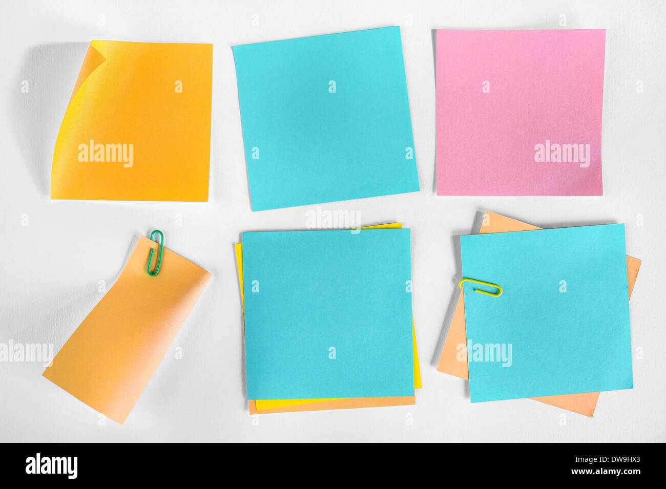 A collection of blank paper notes of different colors and shapes on ...
