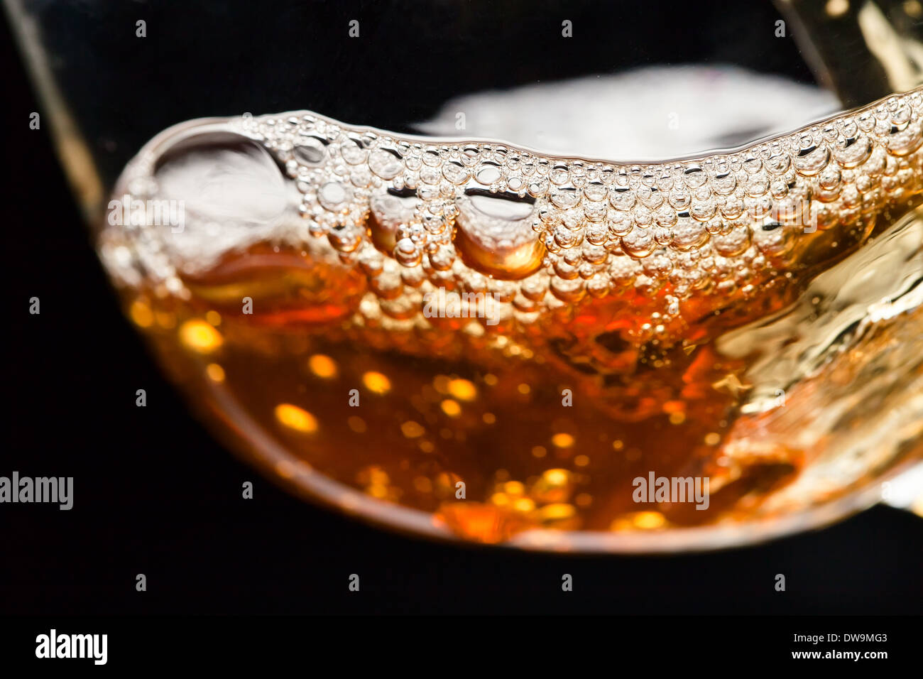 detail of an alcoholic beverage on black background Stock Photo - Alamy