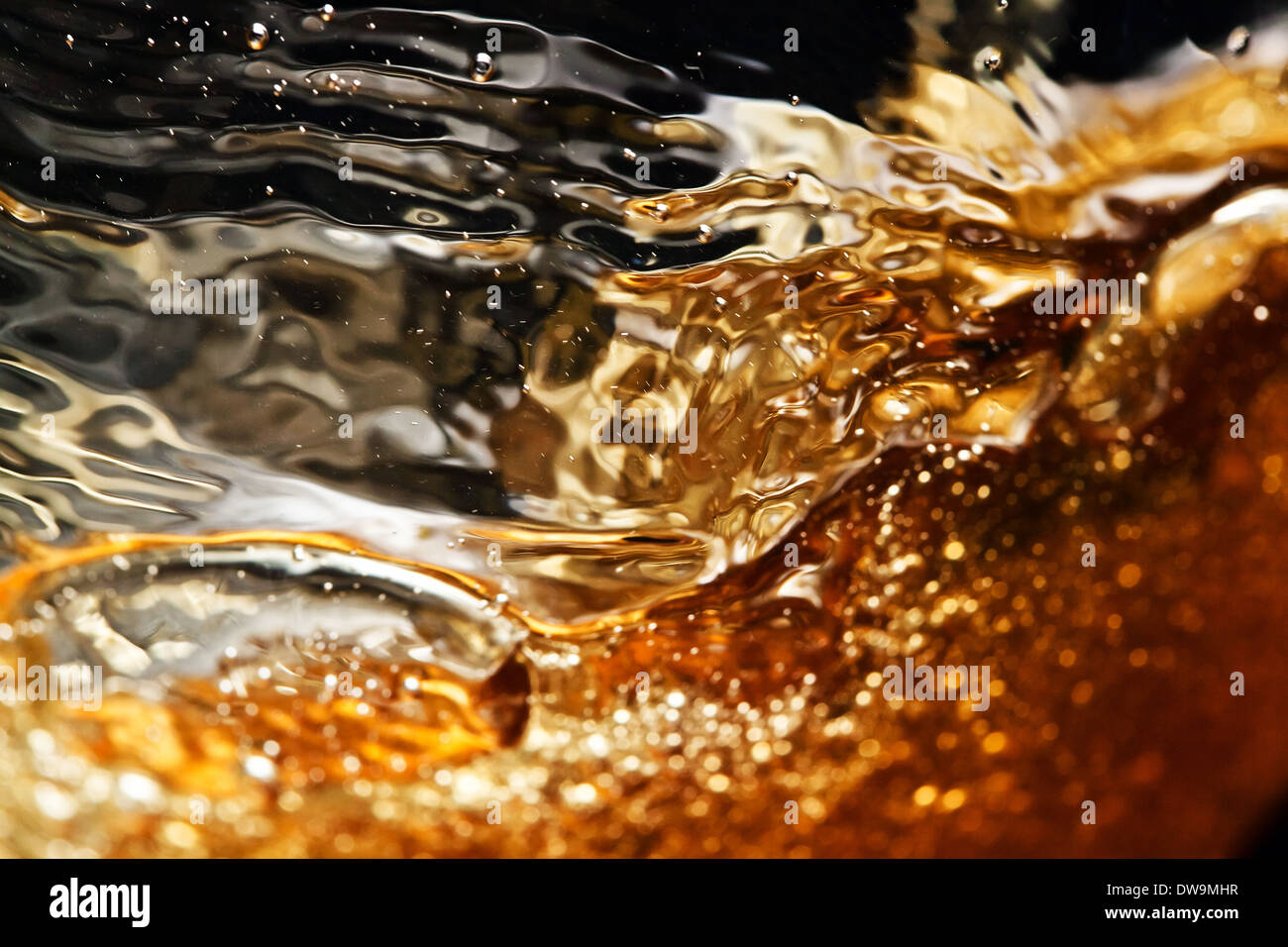 detail of an alcoholic beverage on black background Stock Photo - Alamy