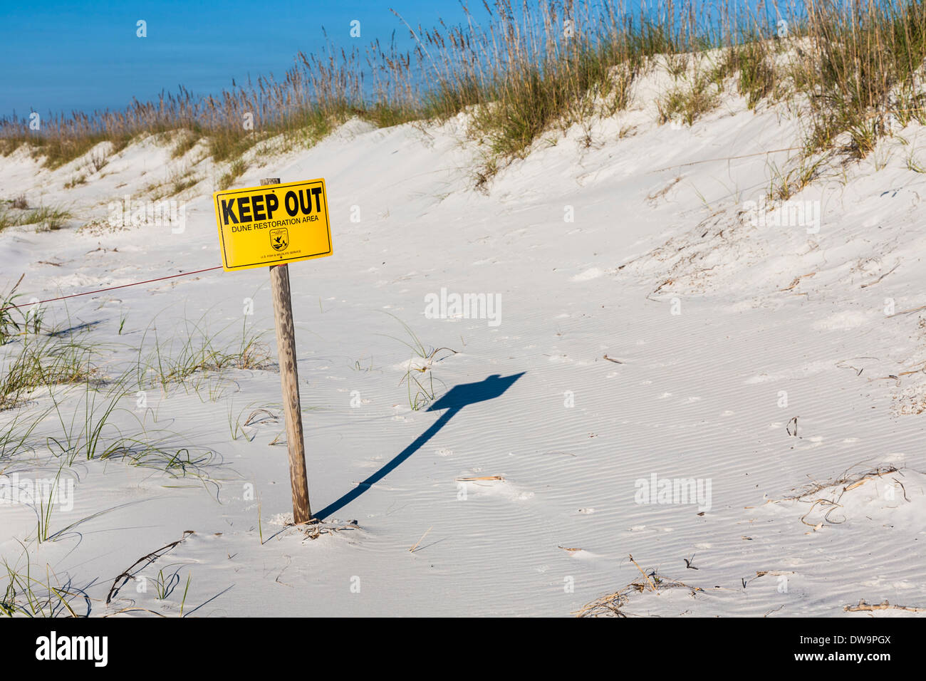 Sign warns to keep out of dune restoration area an beach at Gulf Shores ...