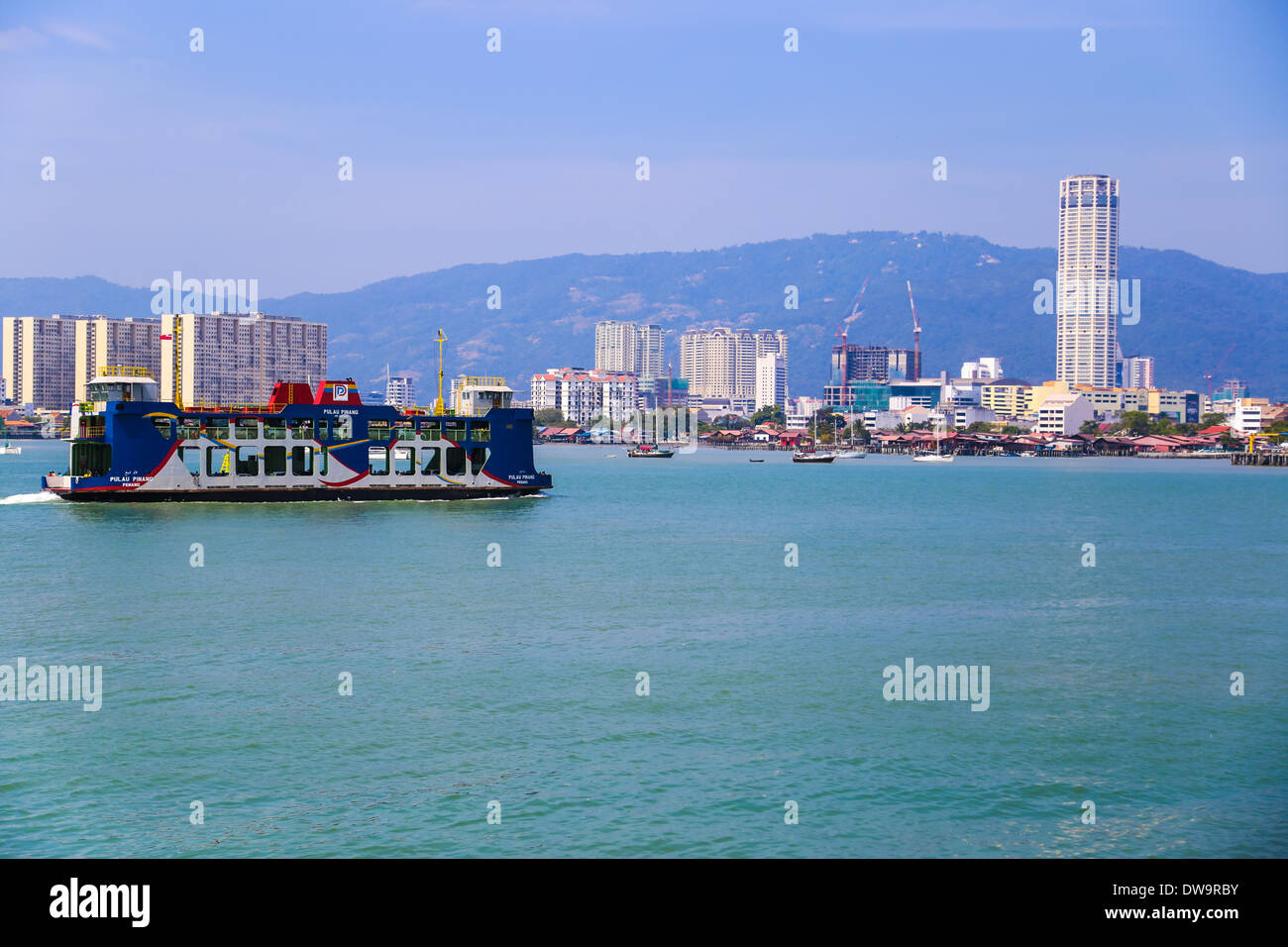 Ferry cruising between Malaysia mainland and Penang island. It is one ...