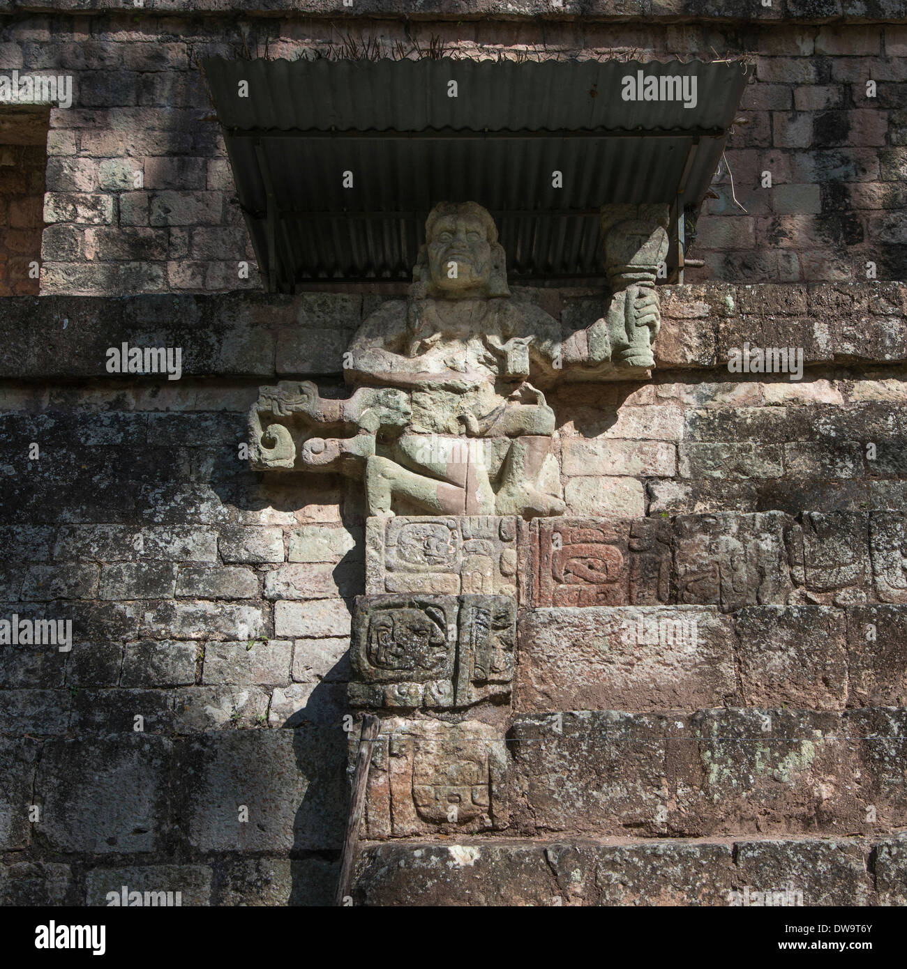 Carved figure at an archaeological site Copan Copan Ruinas Copan ...