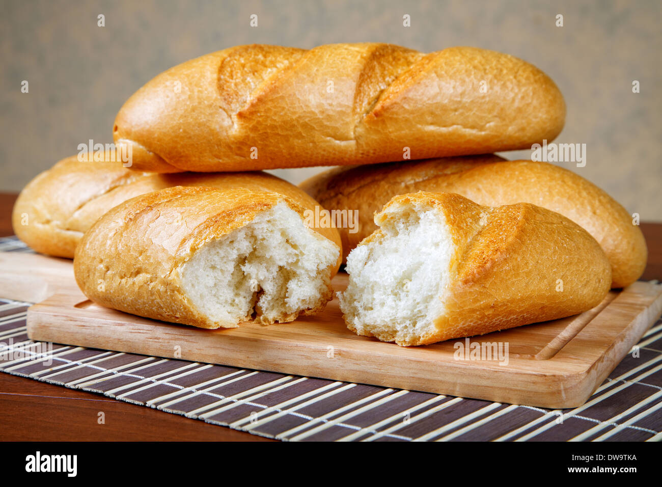 Pile of white rolls on a kitchen table Stock Photo - Alamy