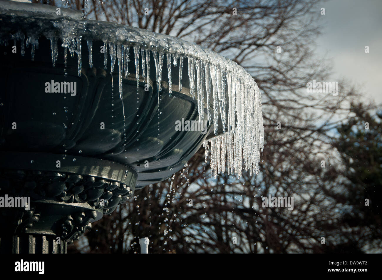 Icicles on a steel fountain Stock Photo - Alamy