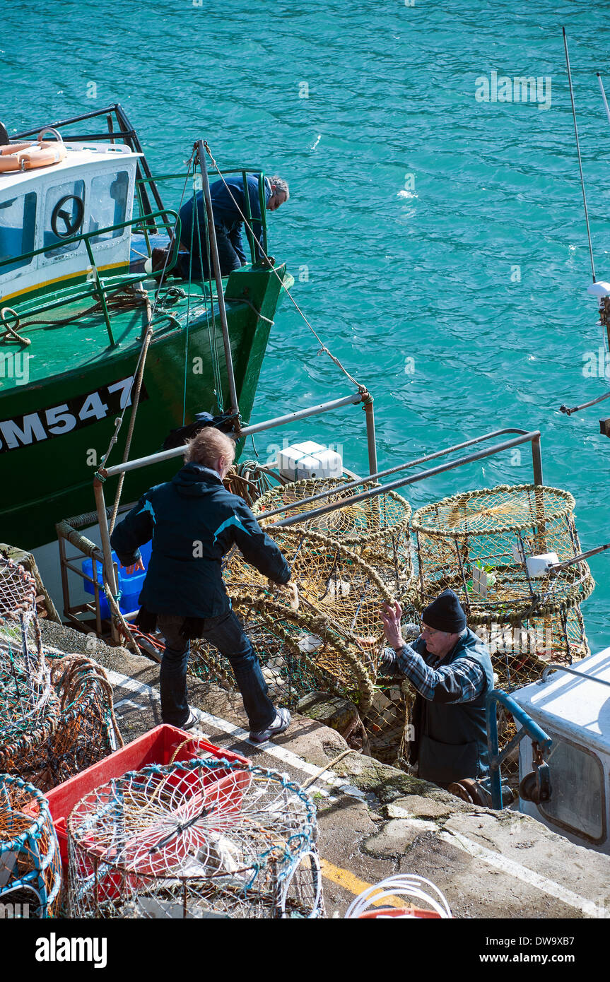 loading lobster pots onto BM 547 brixham harbour,fishing fleet docked ...