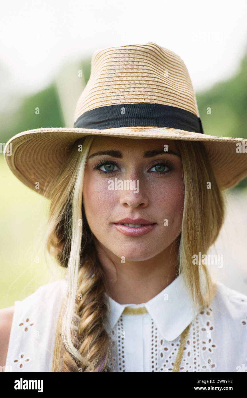 Portrait of young woman wearing hat Stock Photo - Alamy