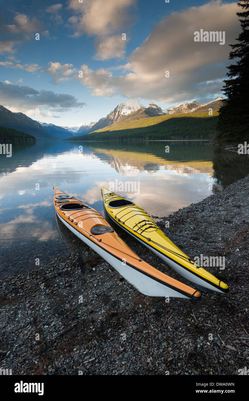 Two kayaks on shore of St. Mary Lake, Glacier National Park, Montana ...