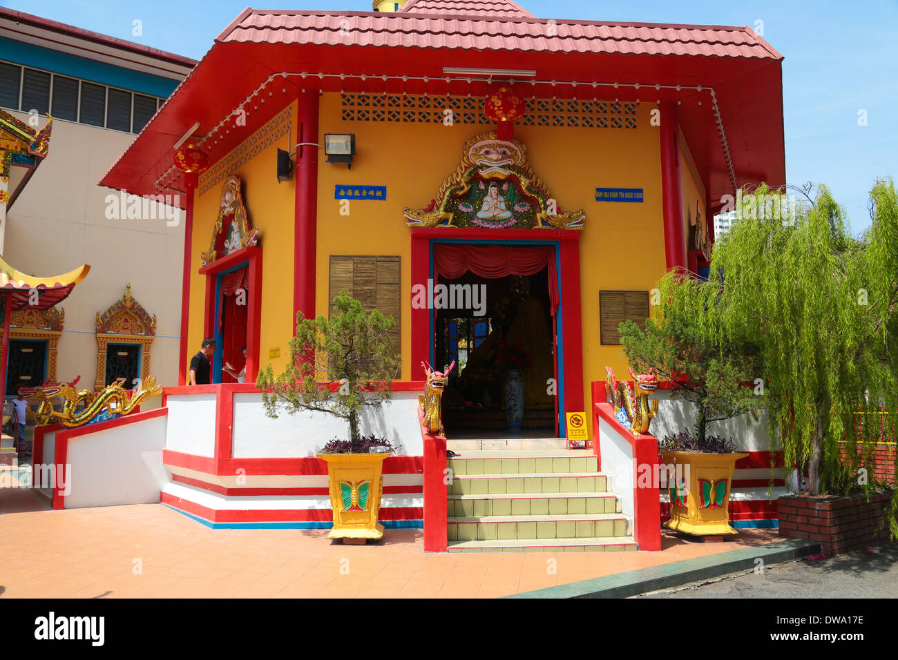 A traditional thai temple structure inside the compound of ...