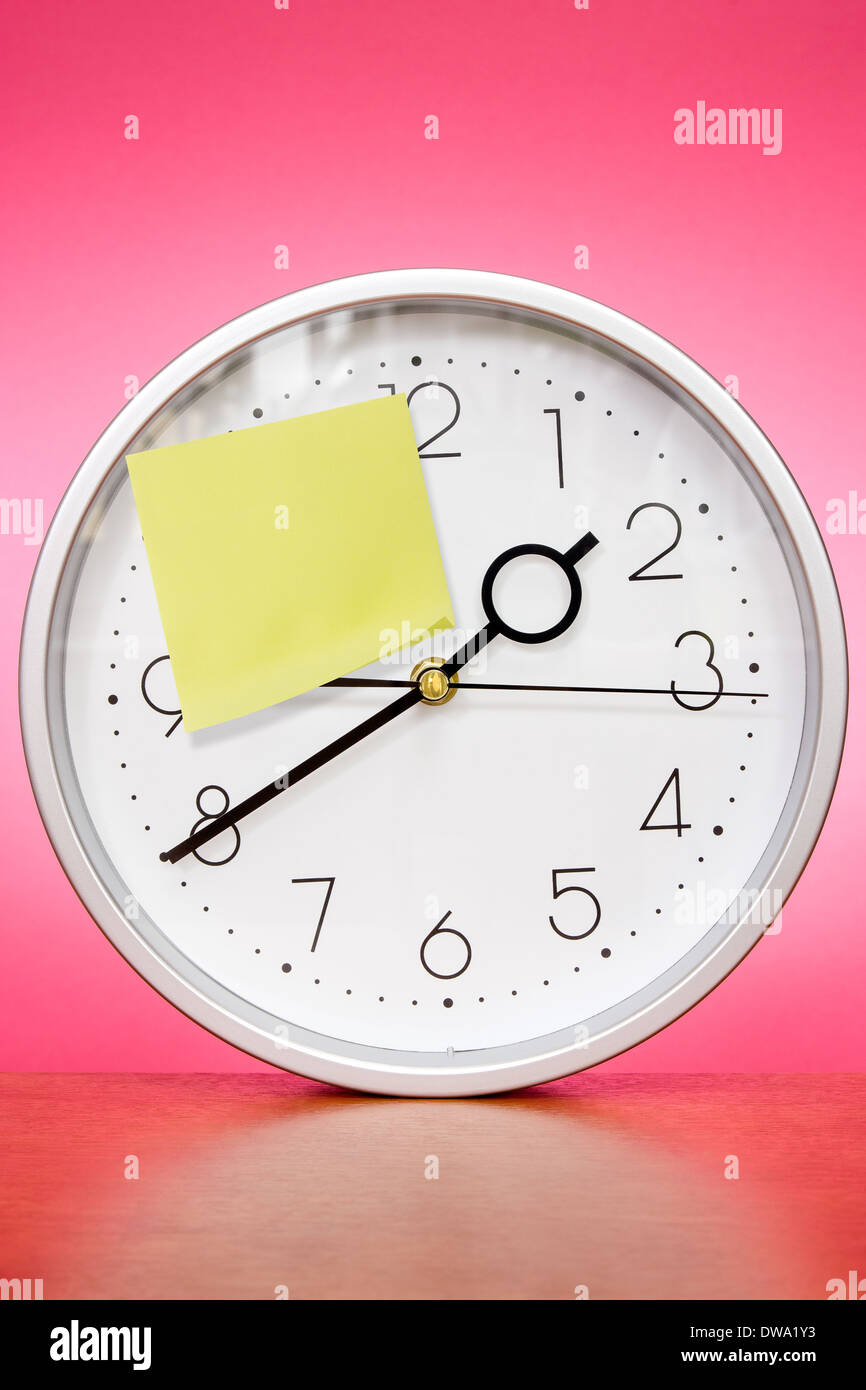 Clock with sticky paper for your own text Stock Photo - Alamy