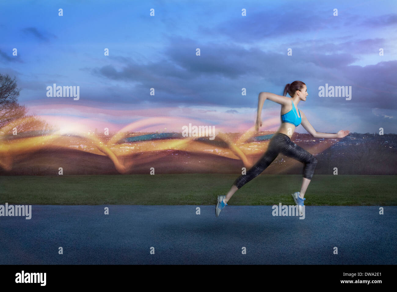 Young woman running with light trails Stock Photo - Alamy
