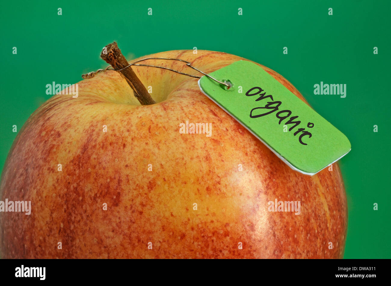 Organic apple with label Stock Photo - Alamy