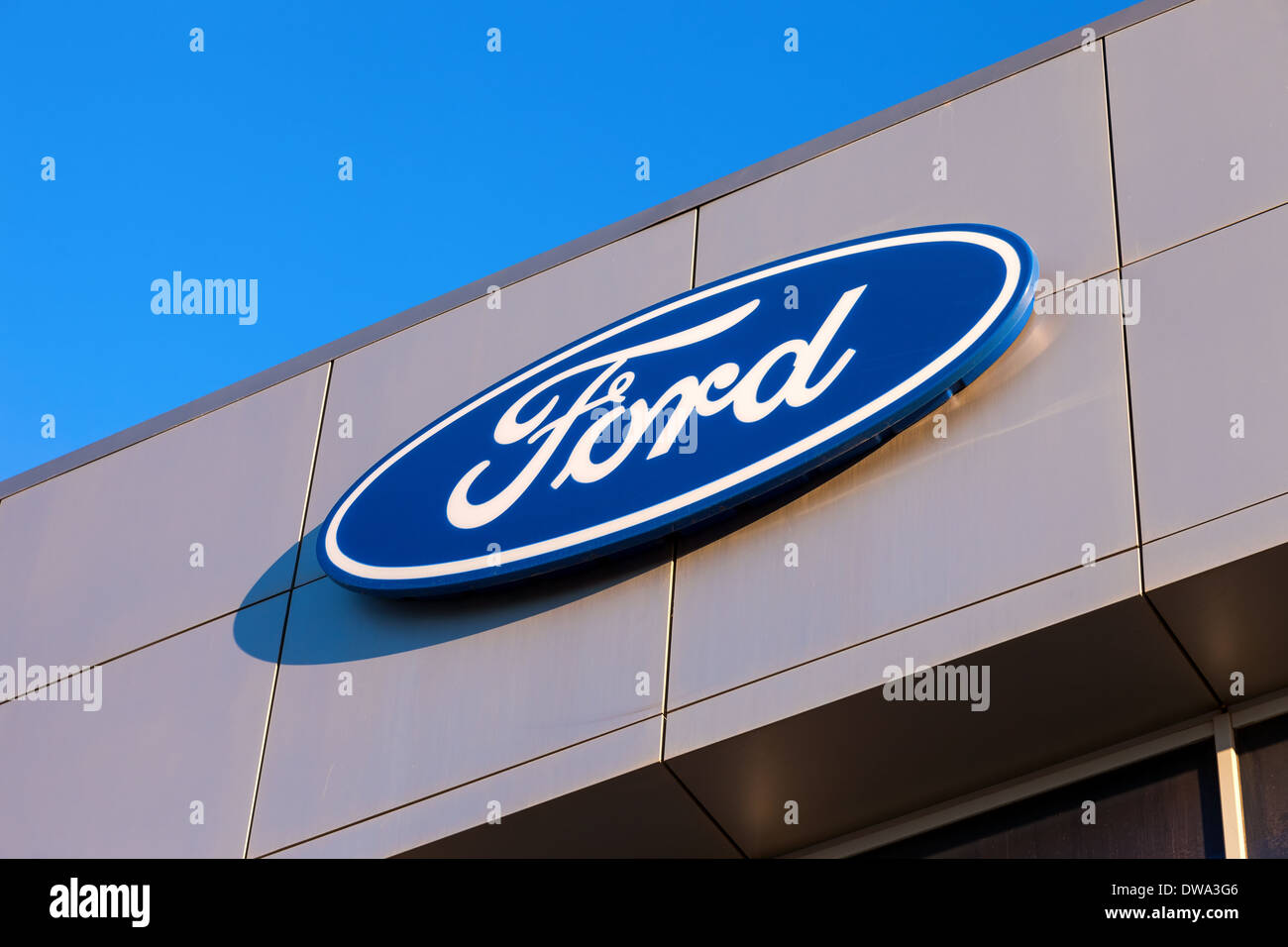 The emblem Ford on the office of official dealer Stock Photo - Alamy
