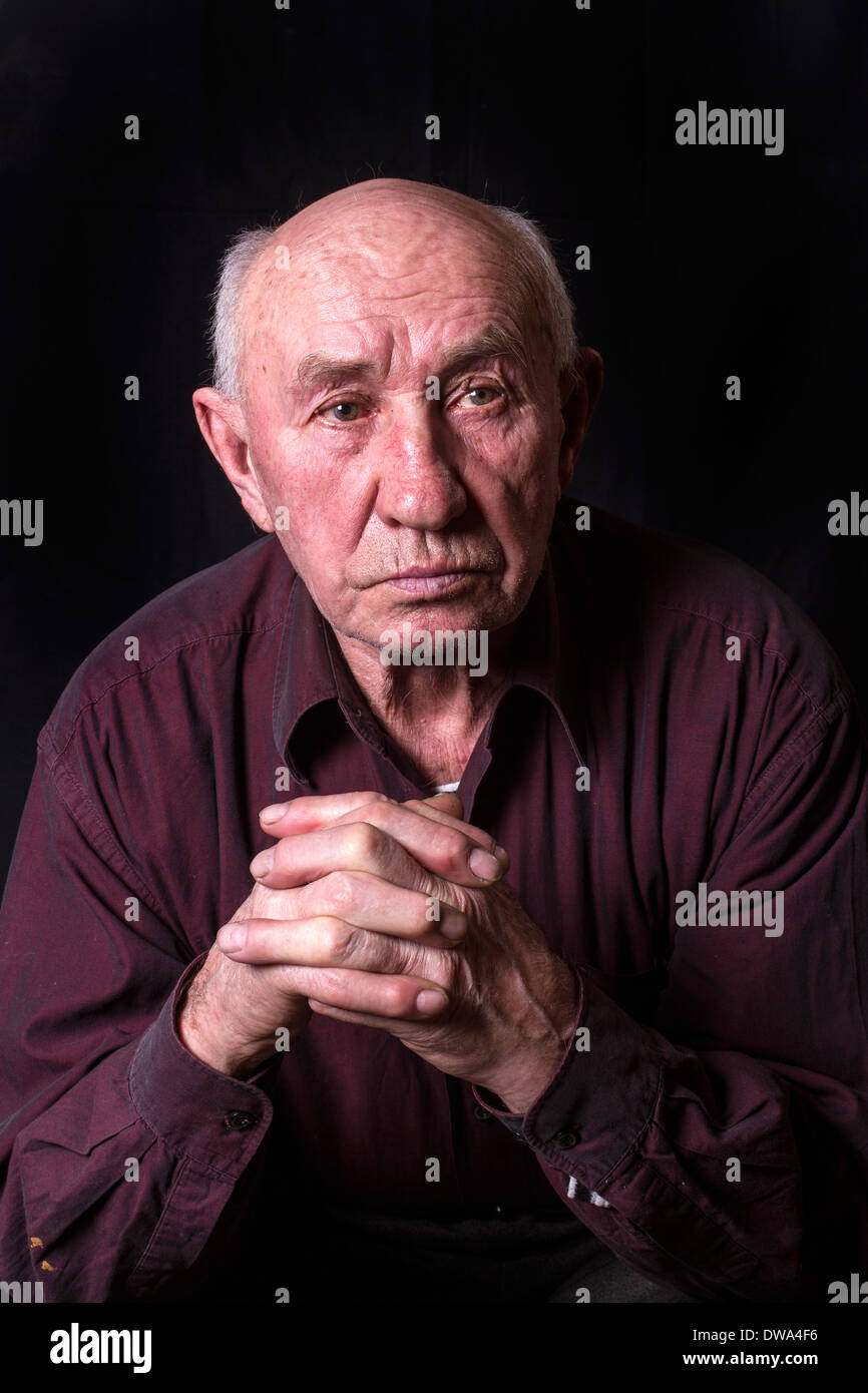 Portrait of an old man on a black background Stock Photo - Alamy