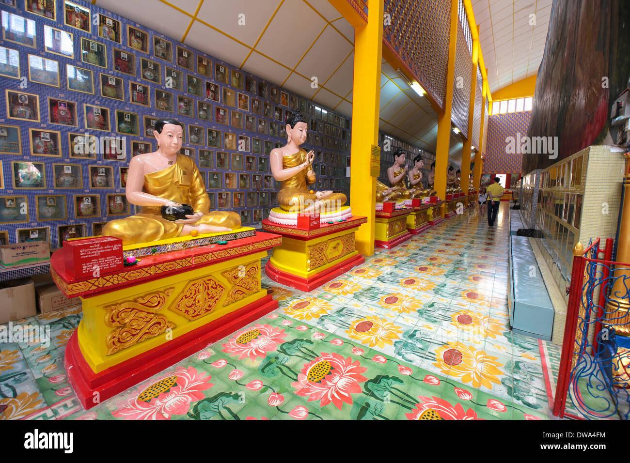 Buddha statues behind the giant sleeping buddha statue inside ...