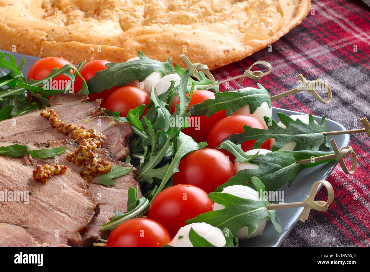 Italian appetizer snacks on checkered tablecloth close up Stock Photo ...