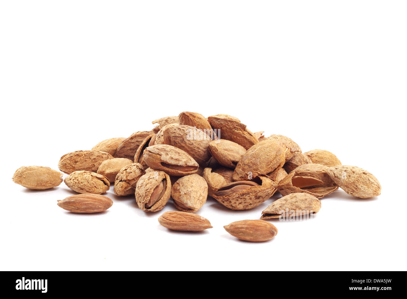 Heap of almond nuts in shell isolated on white background Stock Photo ...