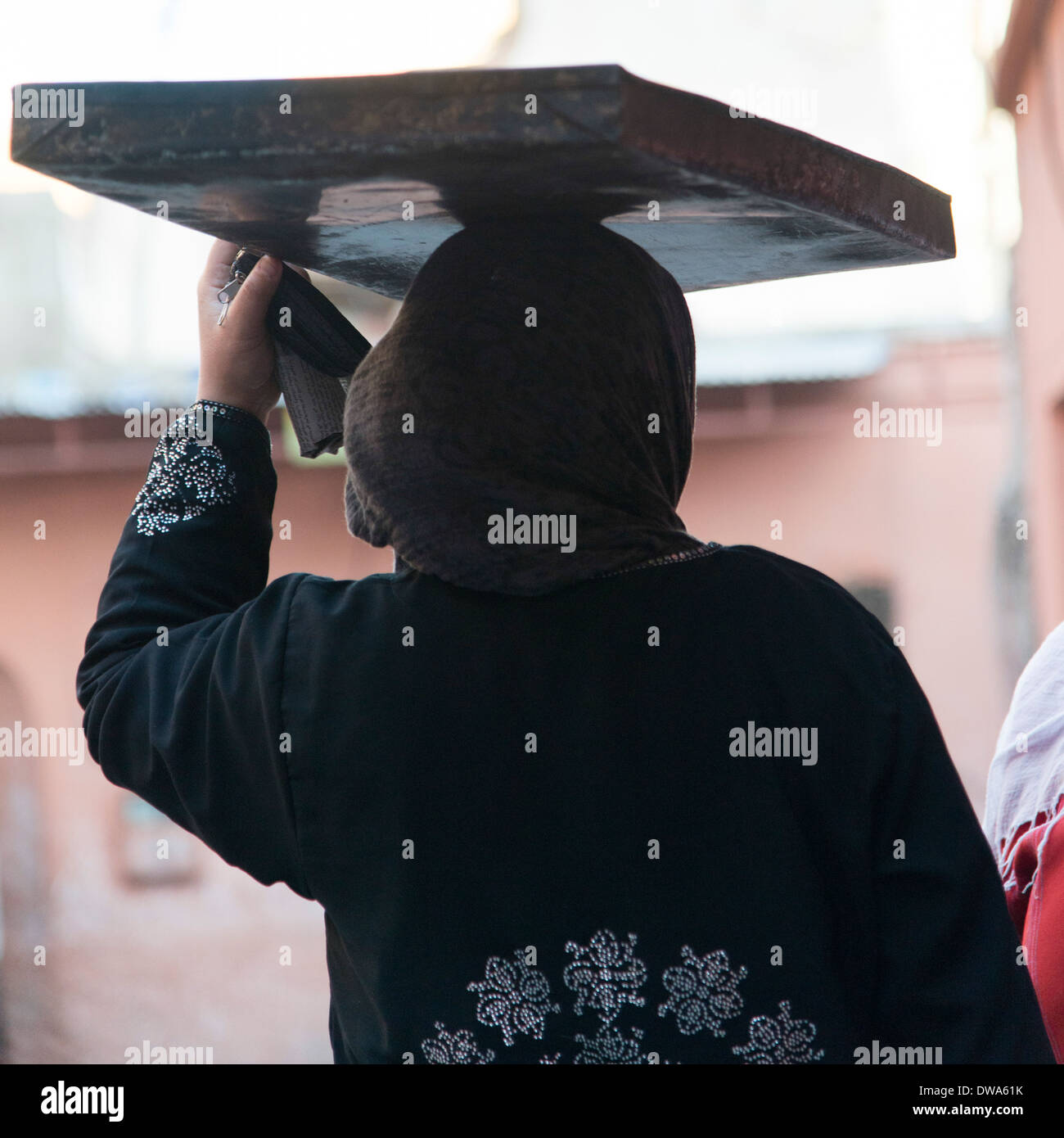 Carrying tray on head hi-res stock photography and images - Alamy