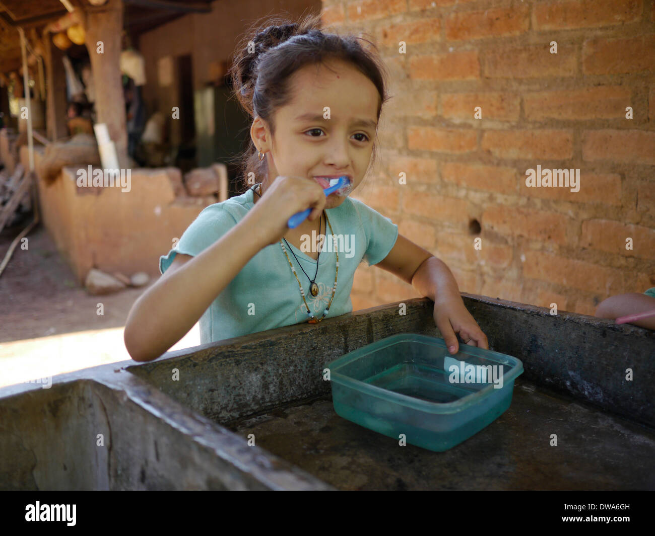 Poor girl brushing teeth hi-res stock photography and images - Alamy