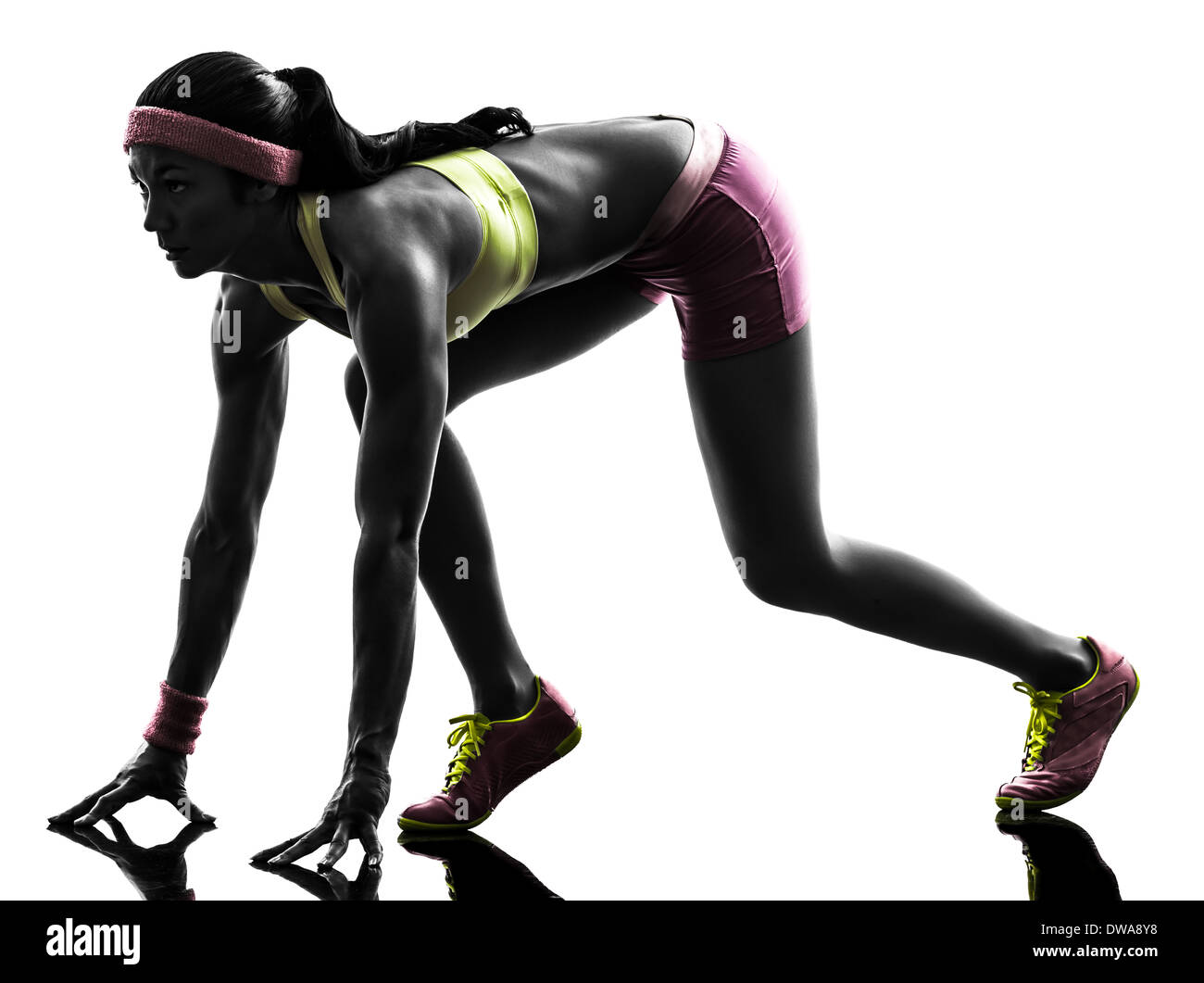 Woman athlete in starting blocks Cut Out Stock Images & Pictures - Alamy