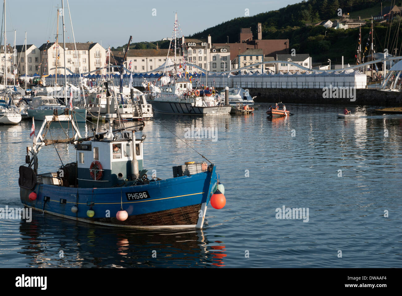 A blue trawler waiting for the harbour gates to open during Whitehaven ...