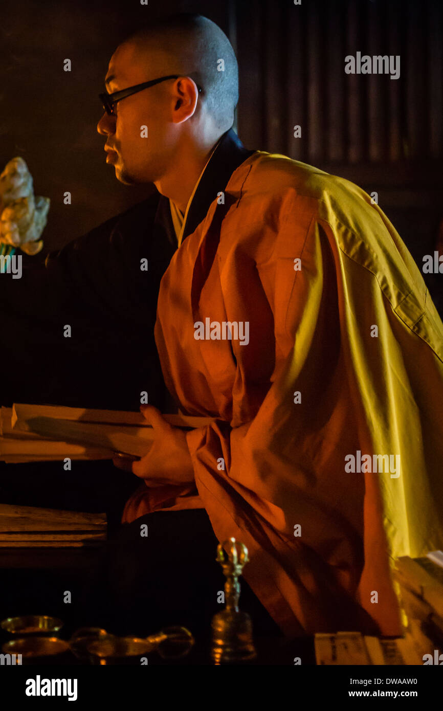 Buddhist priests attend the fire ceremony in one of the temples in ...
