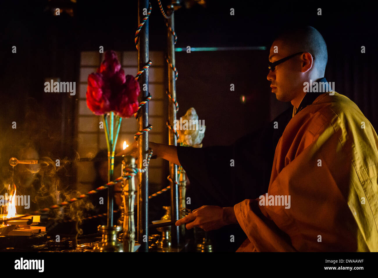 Buddhist priests attend the fire ceremony in one of the temples in ...