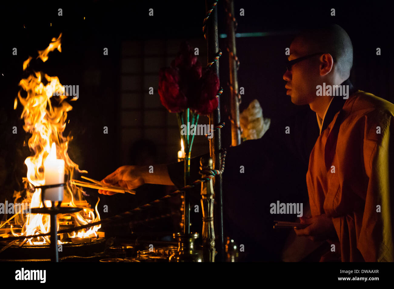 Buddhist priests attend the fire ceremony in one of the temples in ...