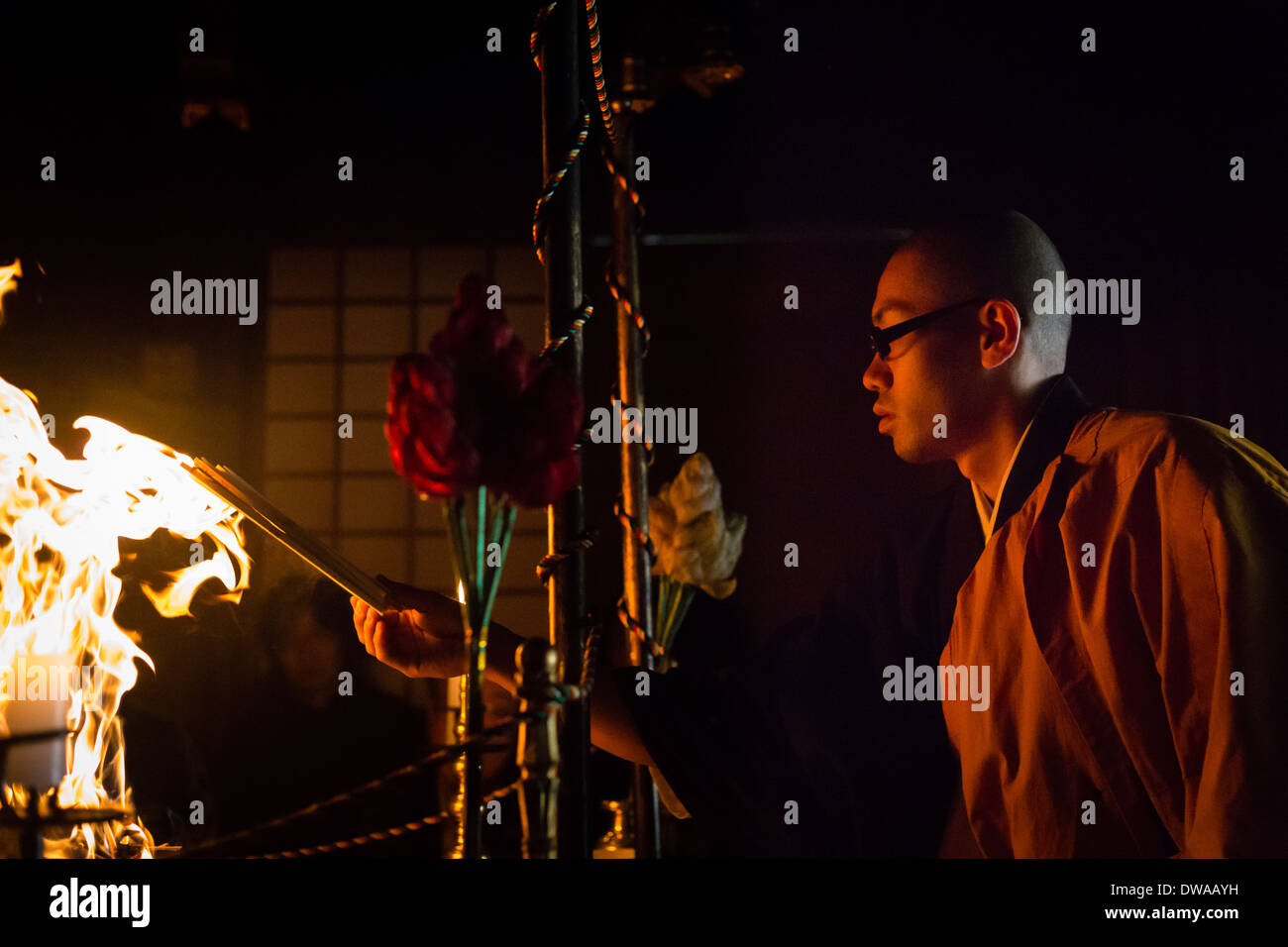 Buddhist priests attend the fire ceremony in one of the temples in ...