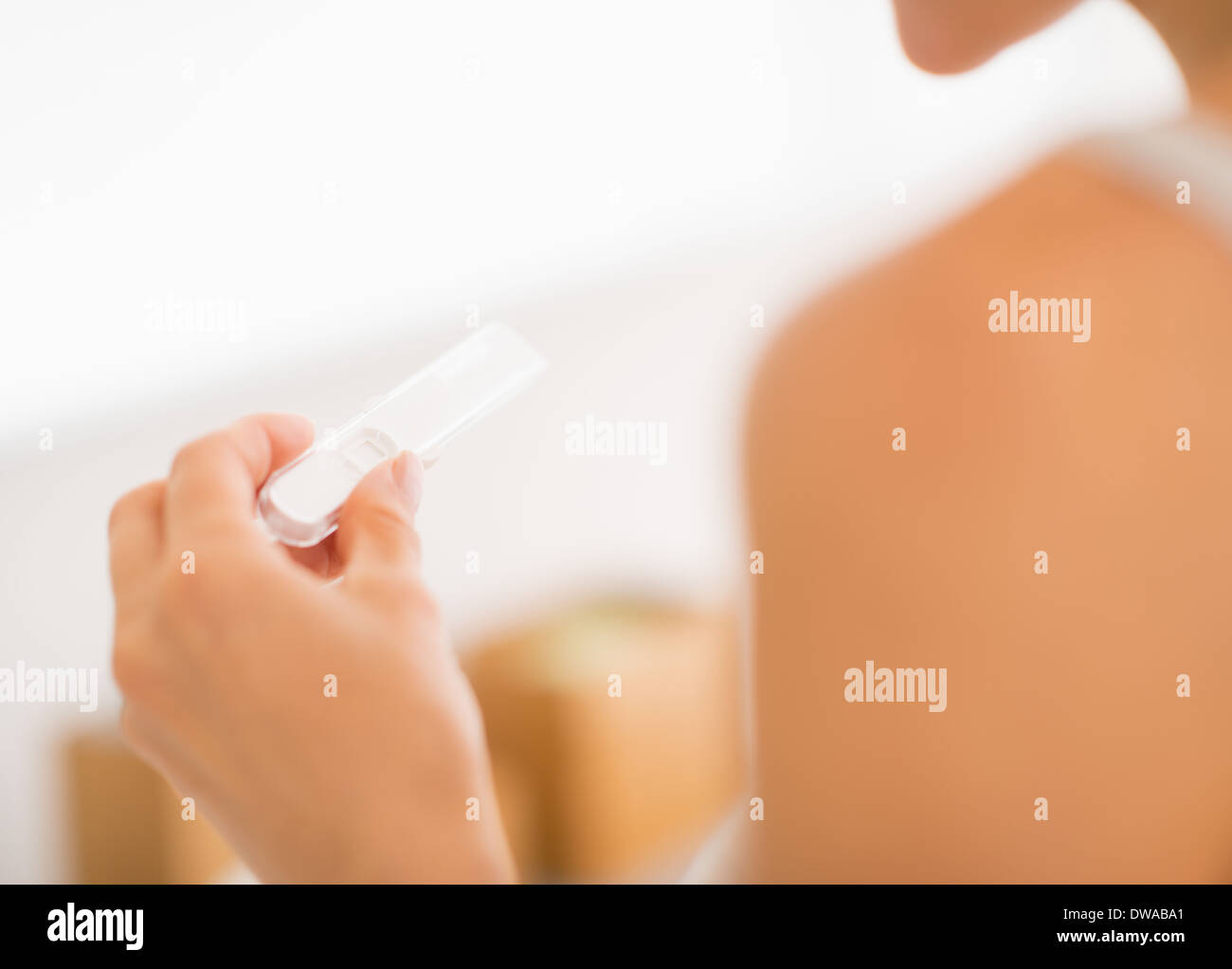 Closeup on young woman looking on pregnancy test Stock Photo - Alamy