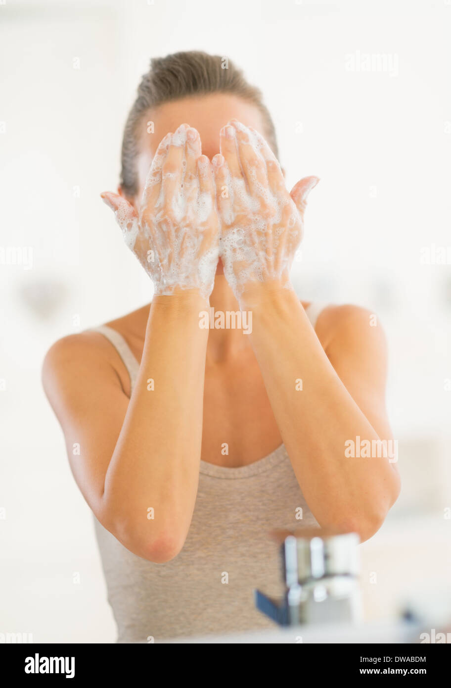 Woman washing her face hi-res stock photography and images - Alamy