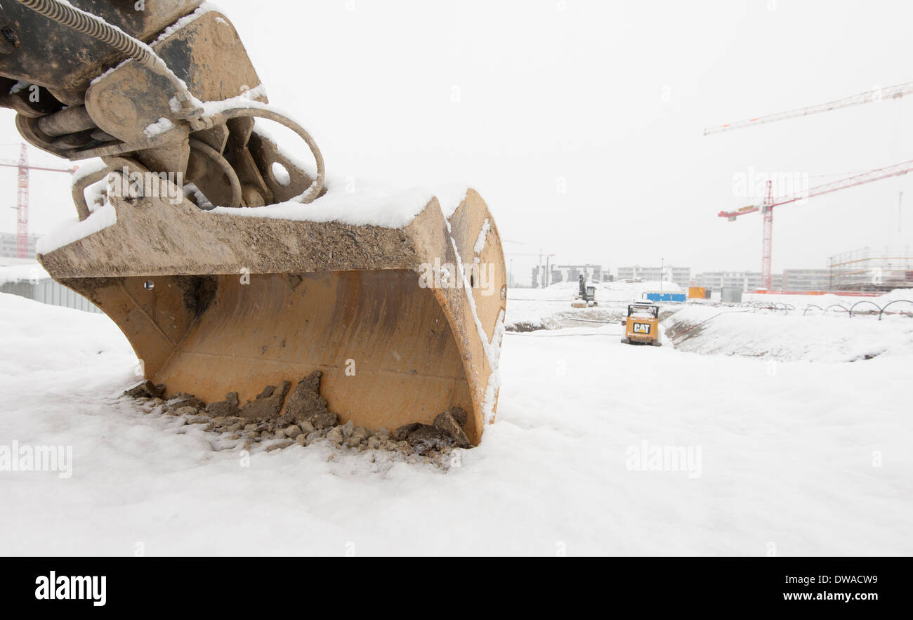 Stopped construction building activity on a snowed winter construction ...