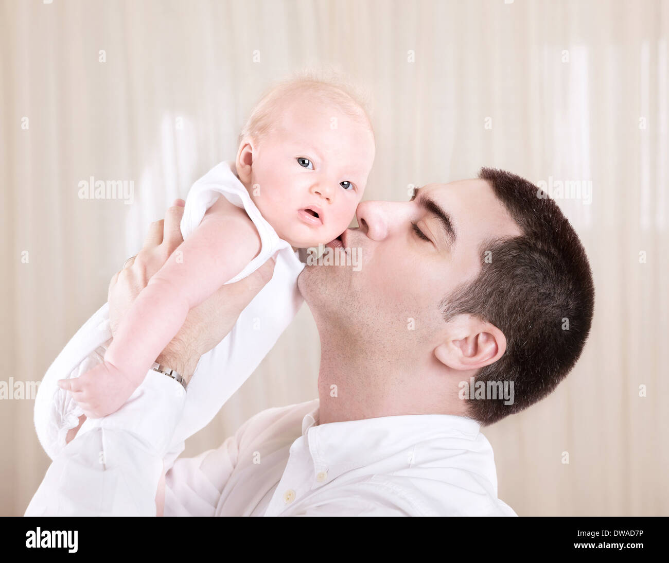 Handsome daddy kissing cute little toddler, man enjoying time spend ...