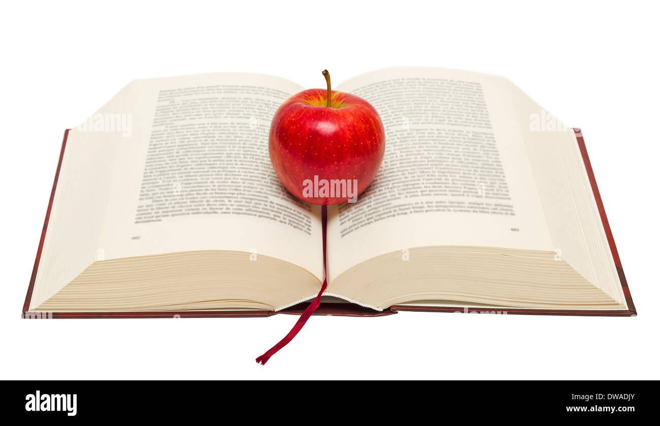 Red apple placed on an open book isolated on white background Stock ...