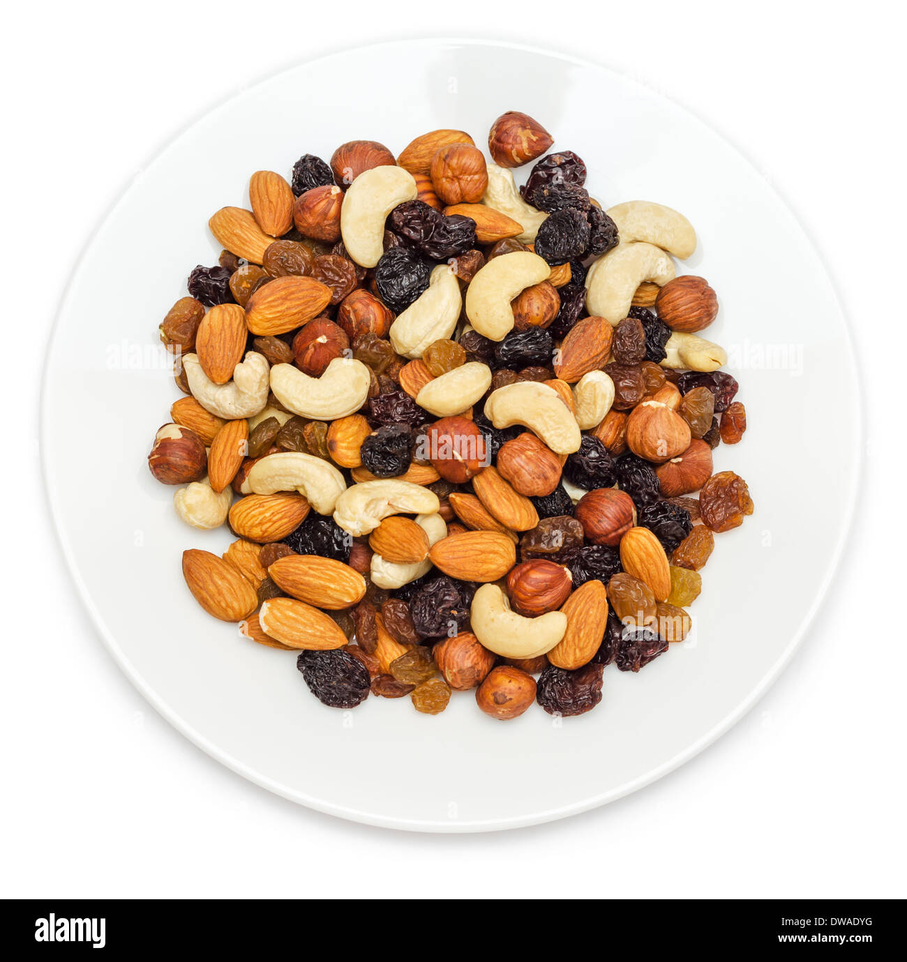 Mixed nuts and dry fruits in plate isolated on white background Stock ...