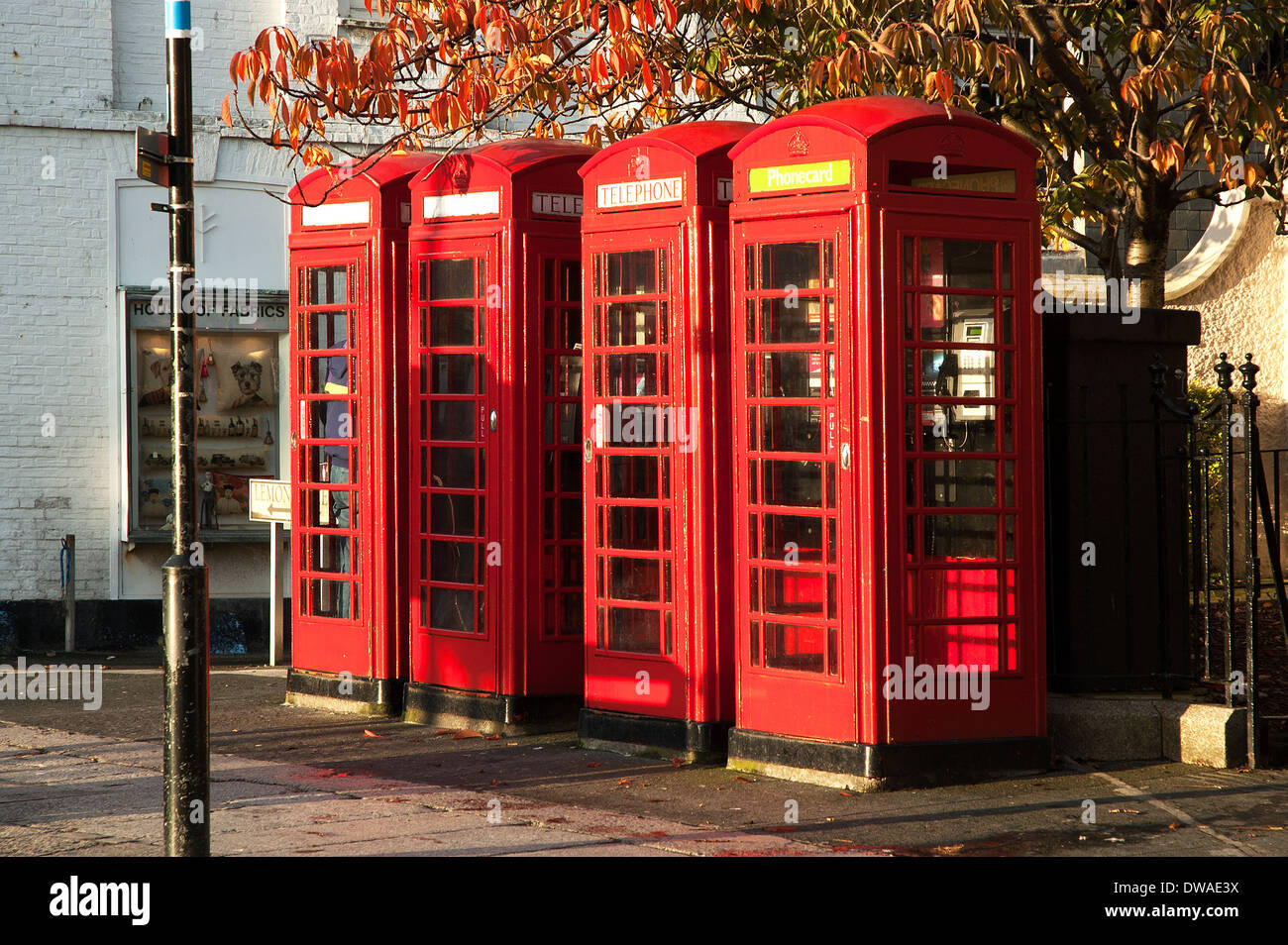 four red telephone boxes Stock Photo - Alamy