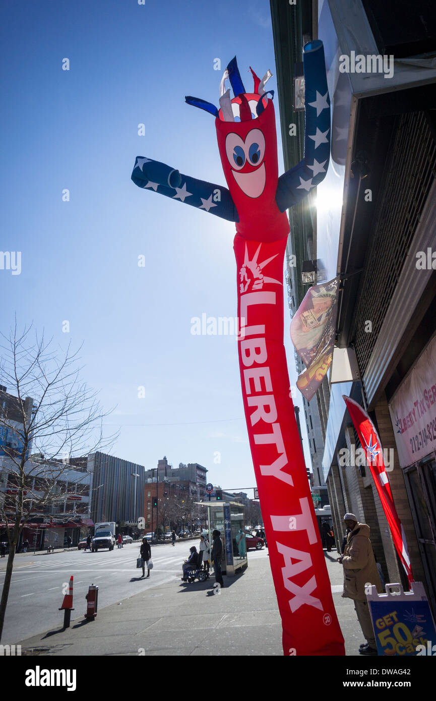 An inflatable advertises the presence of a Liberty Tax preparation ...